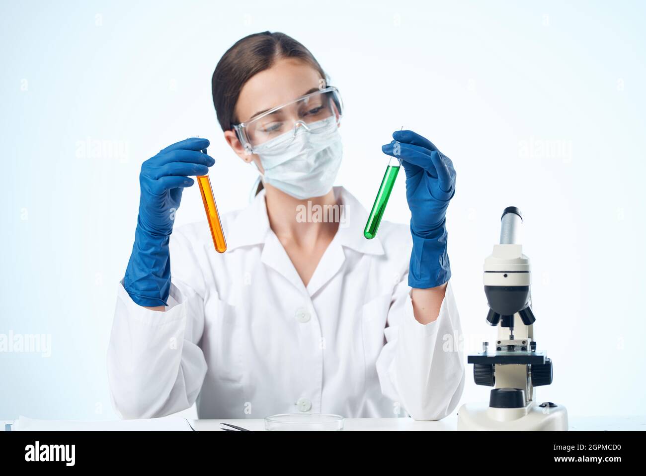 female laboratory assistant desktop chemical solution science ...