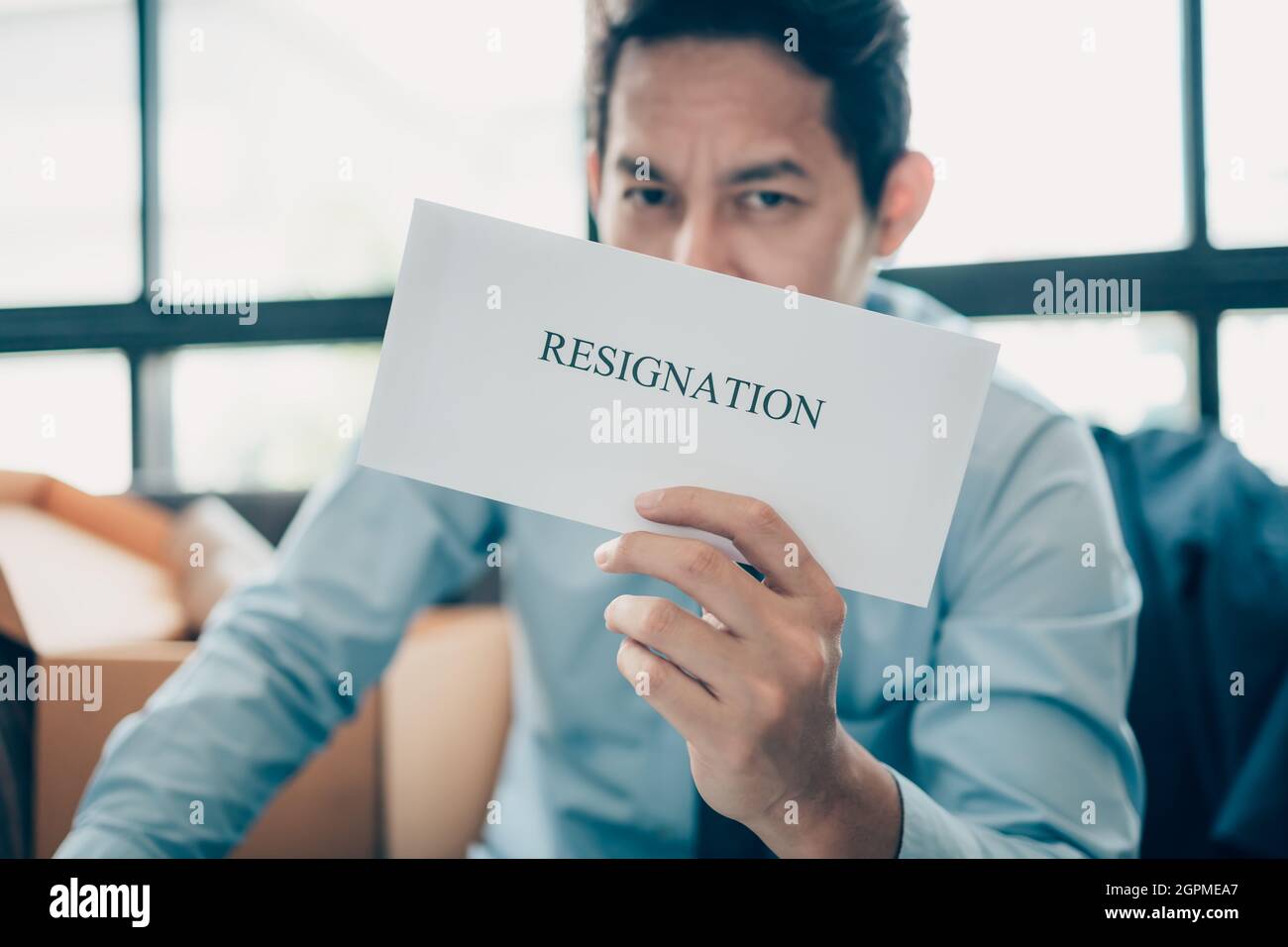 Businessman sending and showing resignation letter to employer boss ...