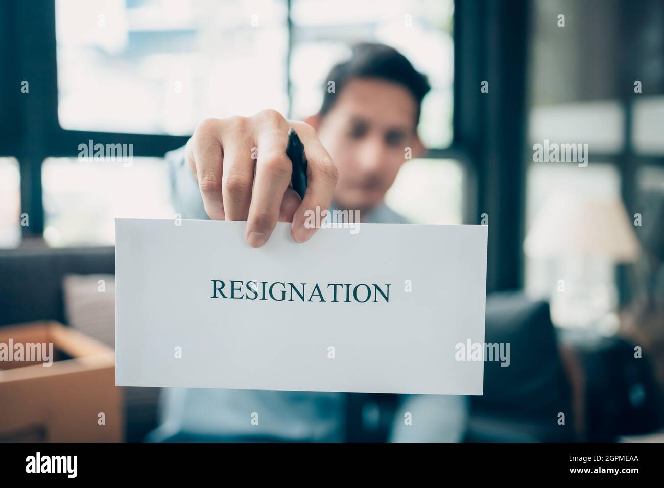 Businessman sending and showing resignation letter to employer boss ...