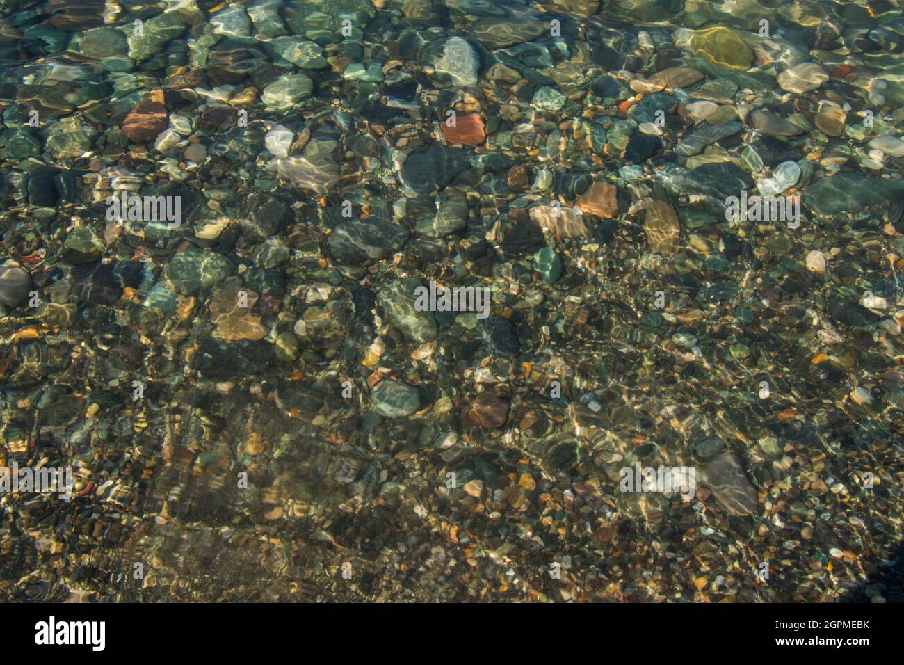 Stones in clear water of sea, water and stones background Stock Photo ...