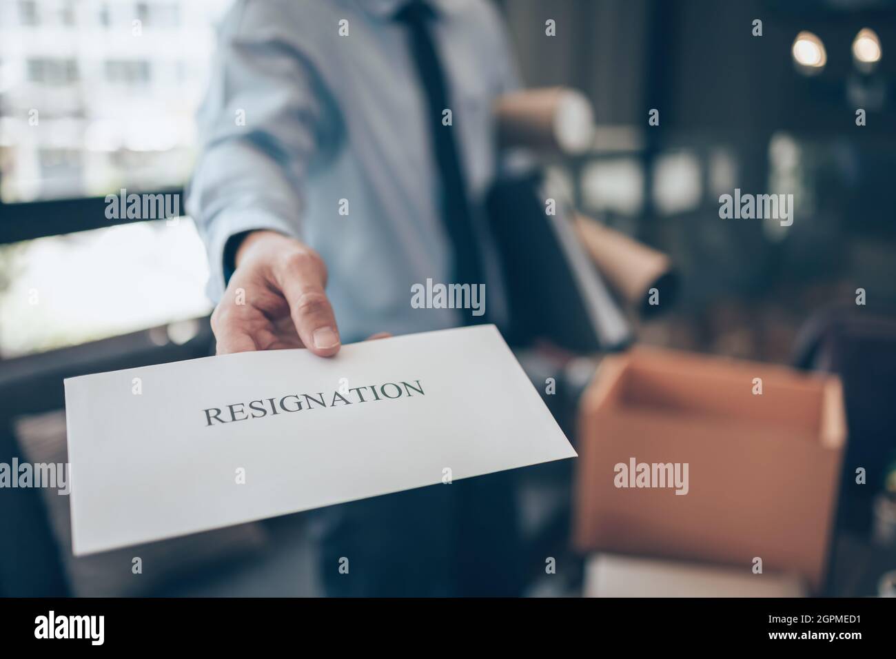 Businessman sending and showing resignation letter to employer boss ...