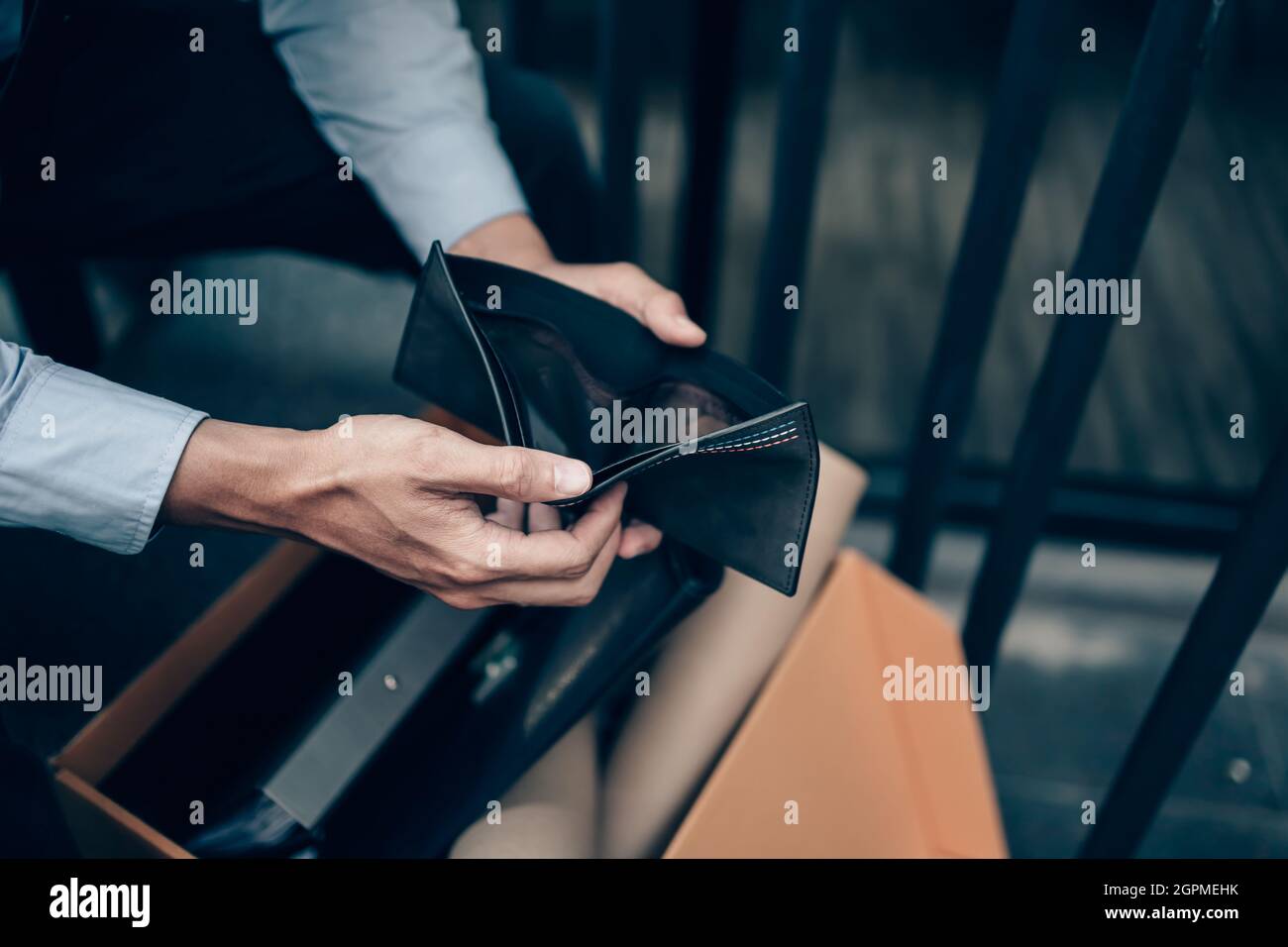 Office worker lost his job and open a wallet without money. Man empty ...