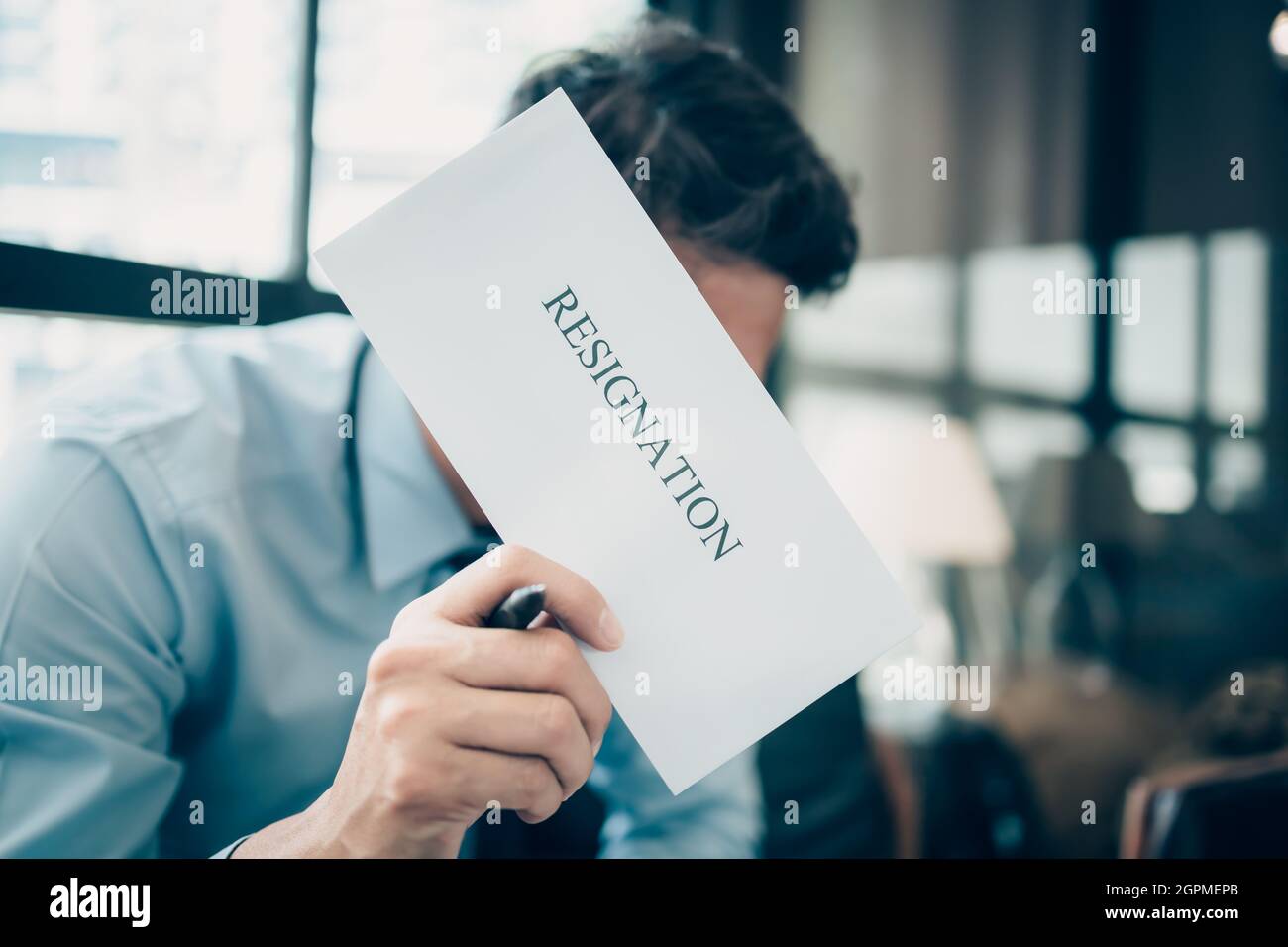 Businessman sending and showing resignation letter to employer boss ...