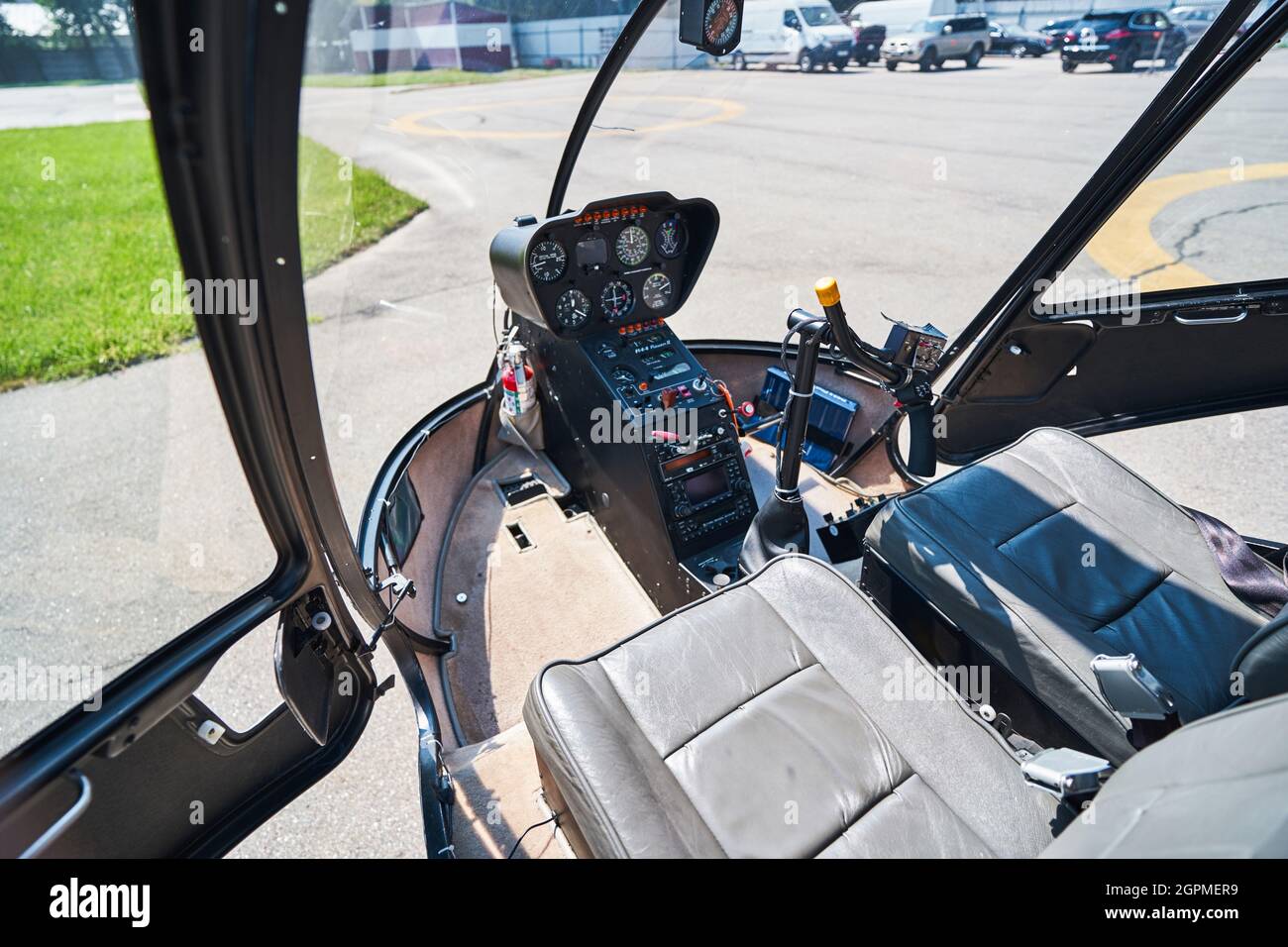Empty helicopter parked on landing pad at heliport Stock Photo - Alamy