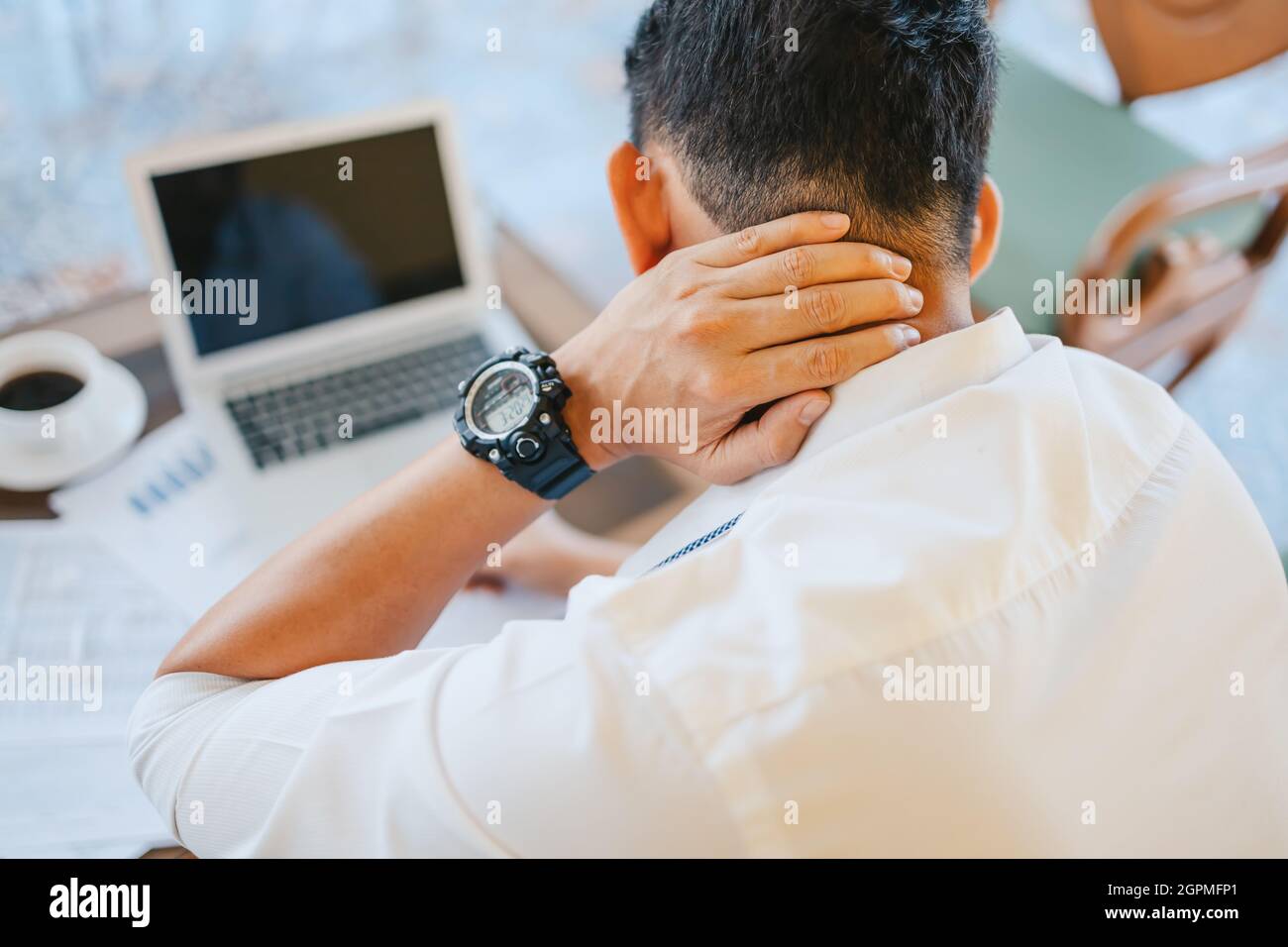 Businessman painful neck while sitting at sofa in workplace. Office ...