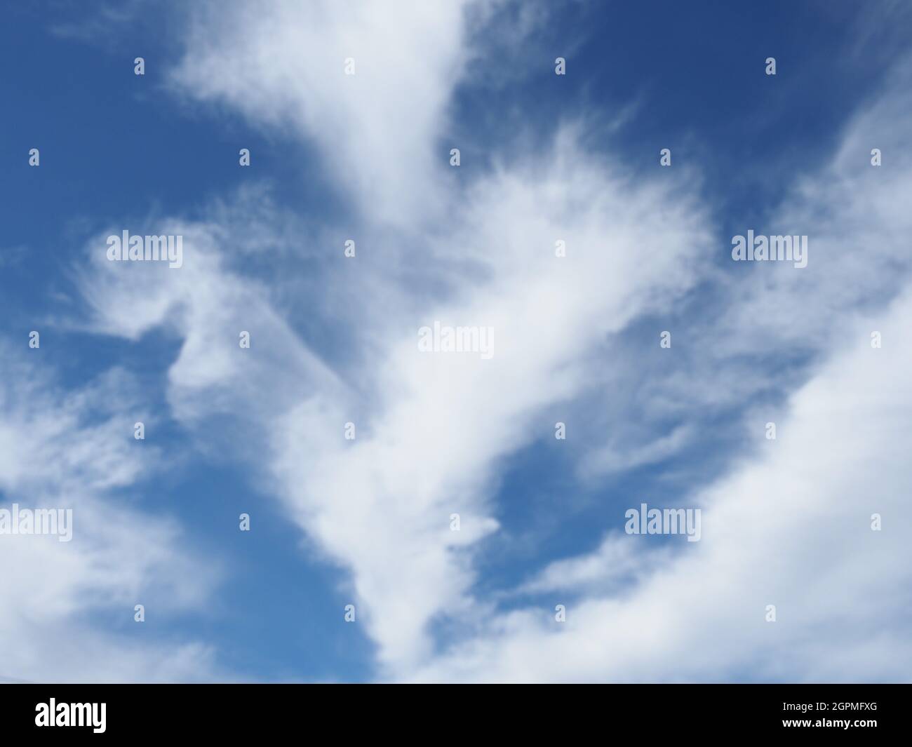 out of focus blue sky with clouds useful as a background Stock Photo ...