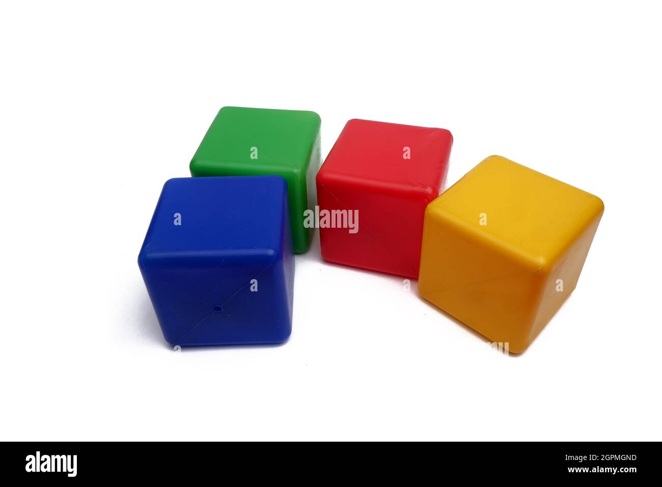 children's multicolored plastic cubes isolated on a white background ...