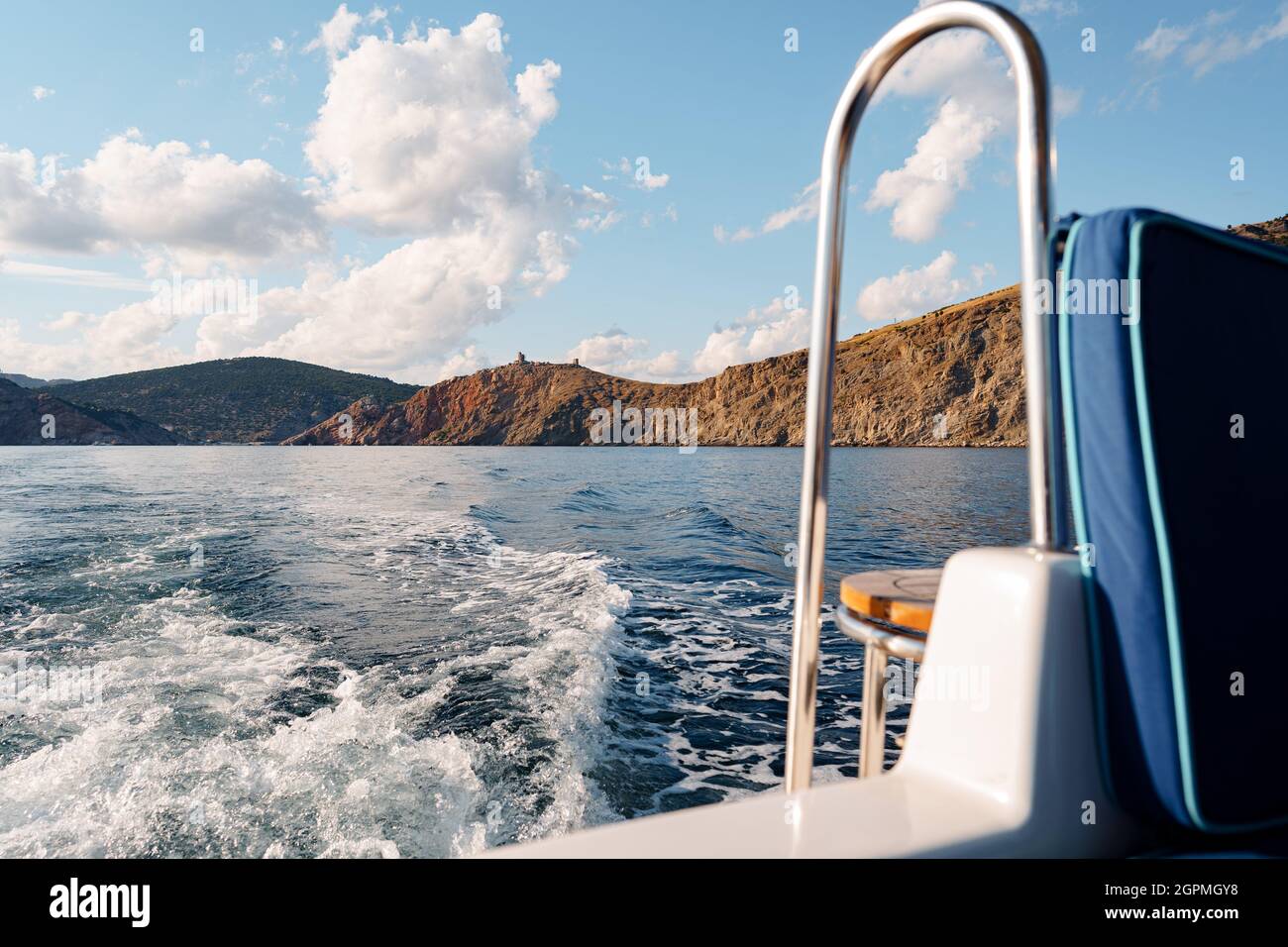 Motor yacht cruising in the sea, view from the stern Stock Photo - Alamy