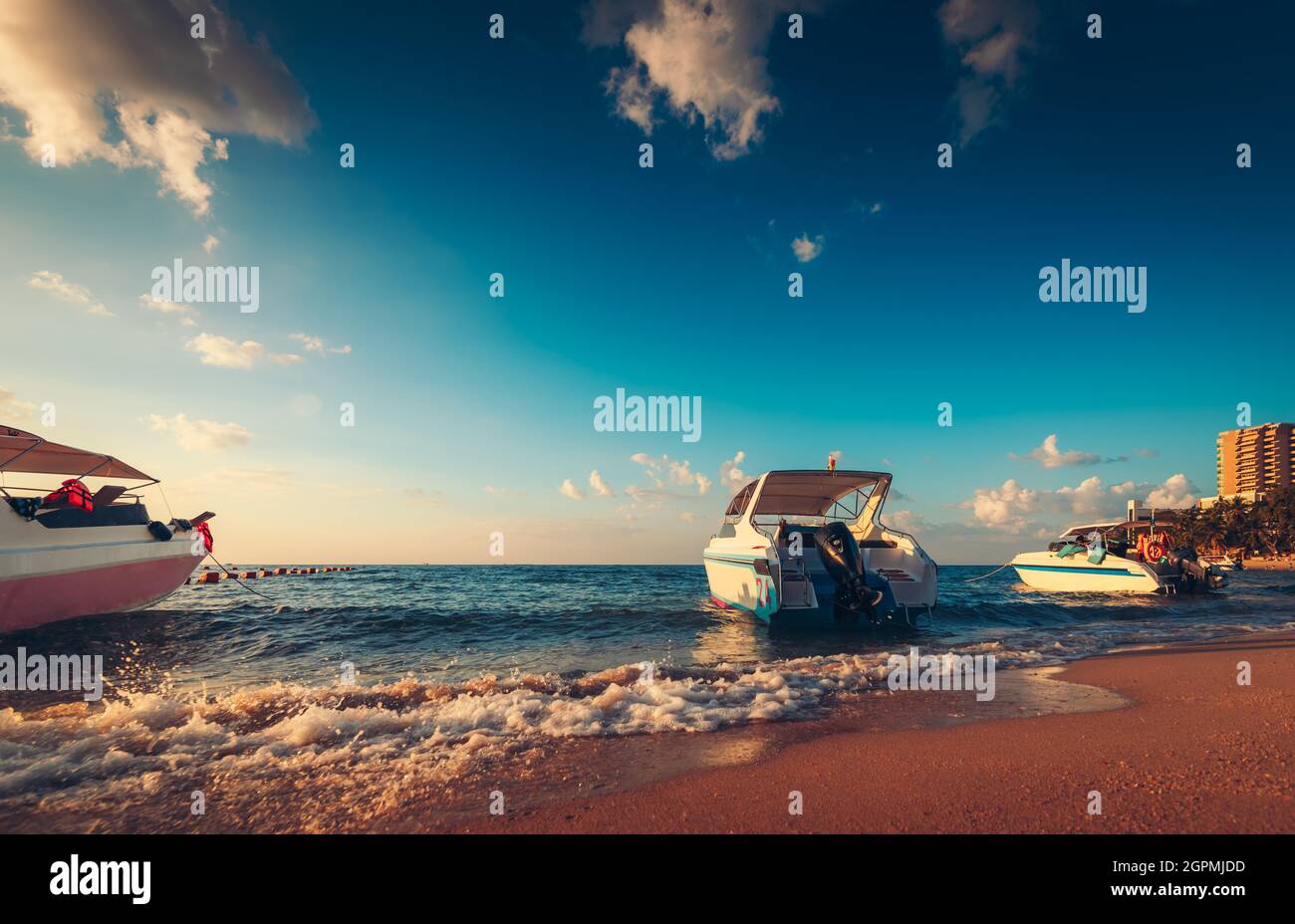 Speed boat at the sea beach and sunset Stock Photo - Alamy