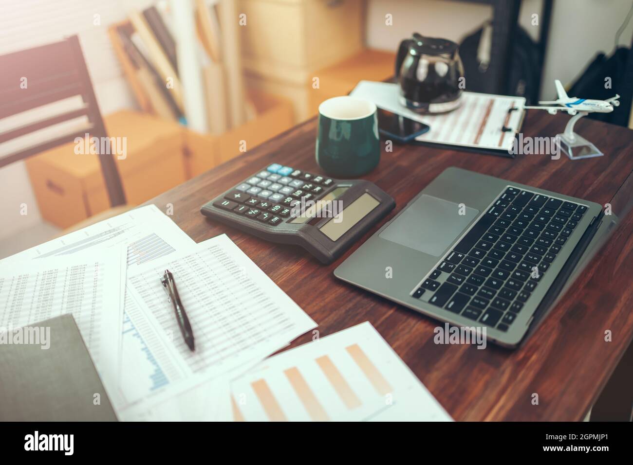 Accounting woking with data sheet on the office desk. Calculator with ...