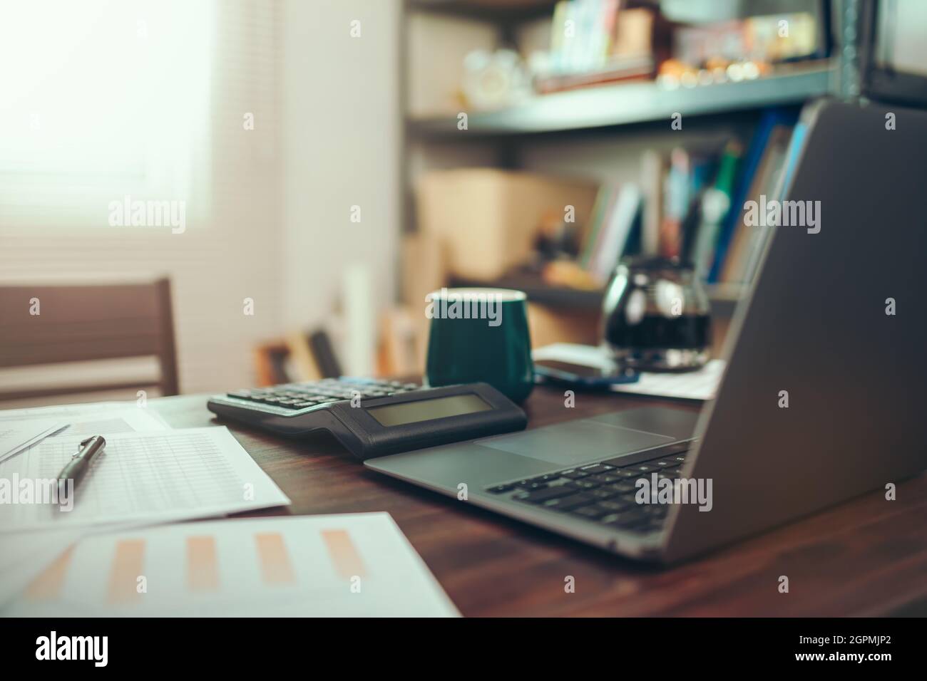 Accounting woking with data sheet on the office desk. Calculator with ...
