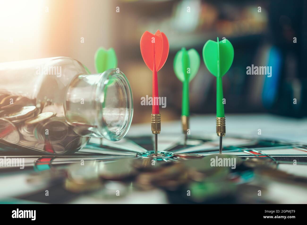 dart board has dart arrow hitting of a shooting target and money coin ...