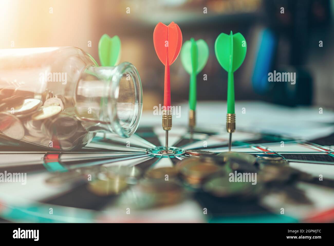 dart board has dart arrow hitting of a shooting target and money coin ...