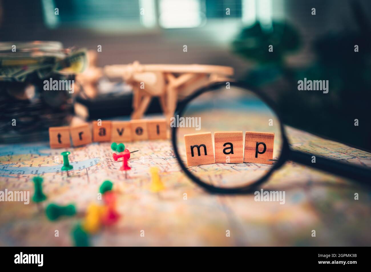 Magnifying glass with Wood square with word "map" on the map. pushpin ...