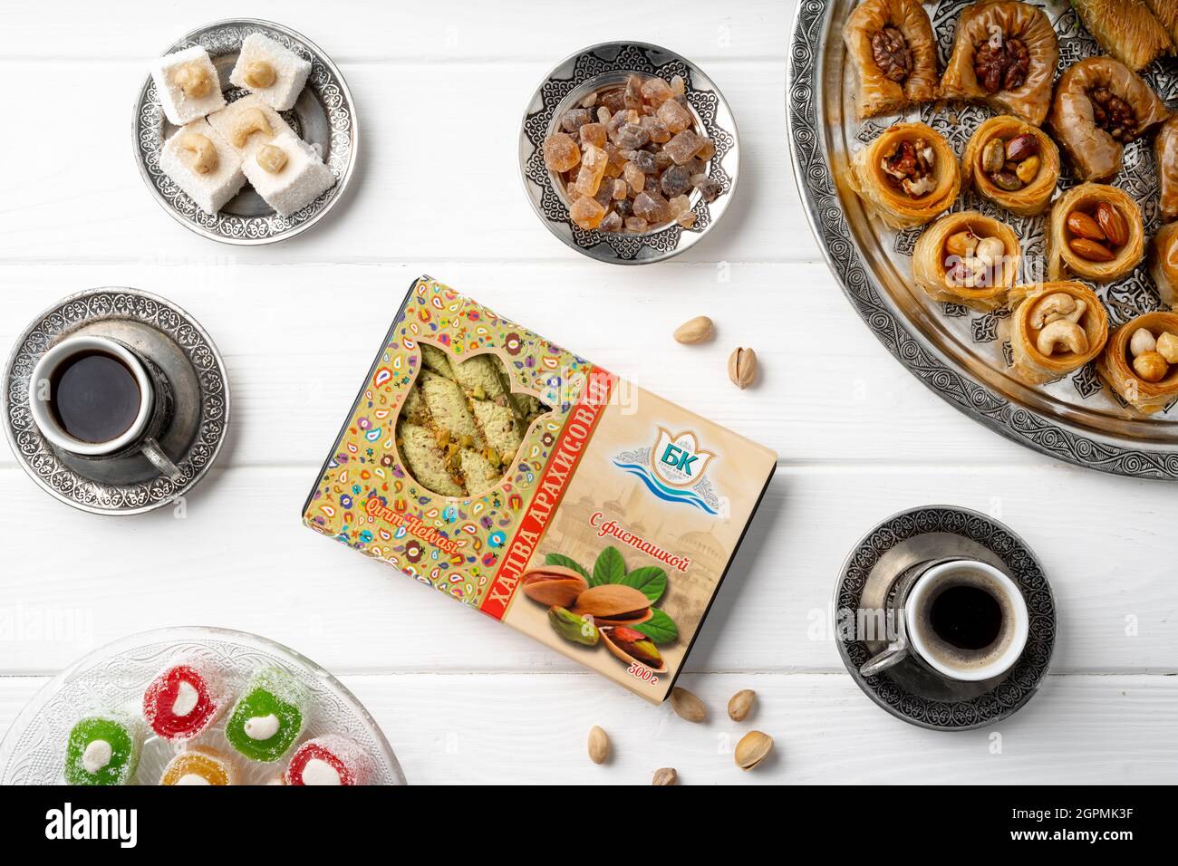 Top view of Turkish sweets and Turkish coffee on white wooden ...