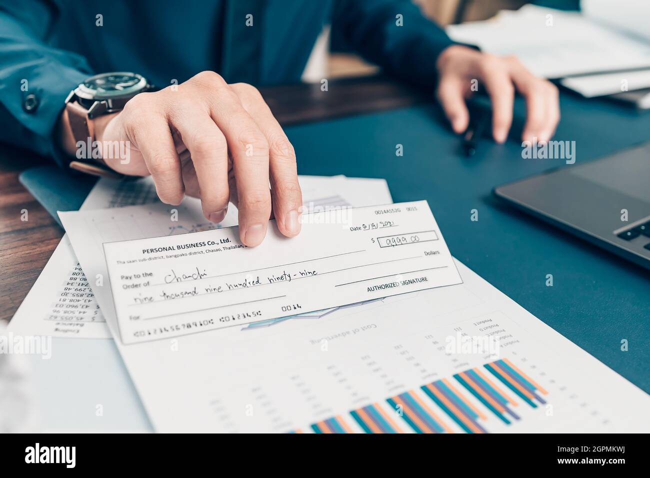 A Businessperson's hand giving cheque to customer and dollar bill, coin ...