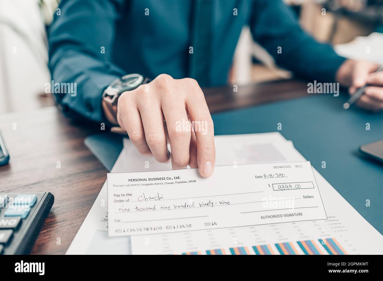 A Businessperson's hand giving cheque to customer and dollar bill, coin ...