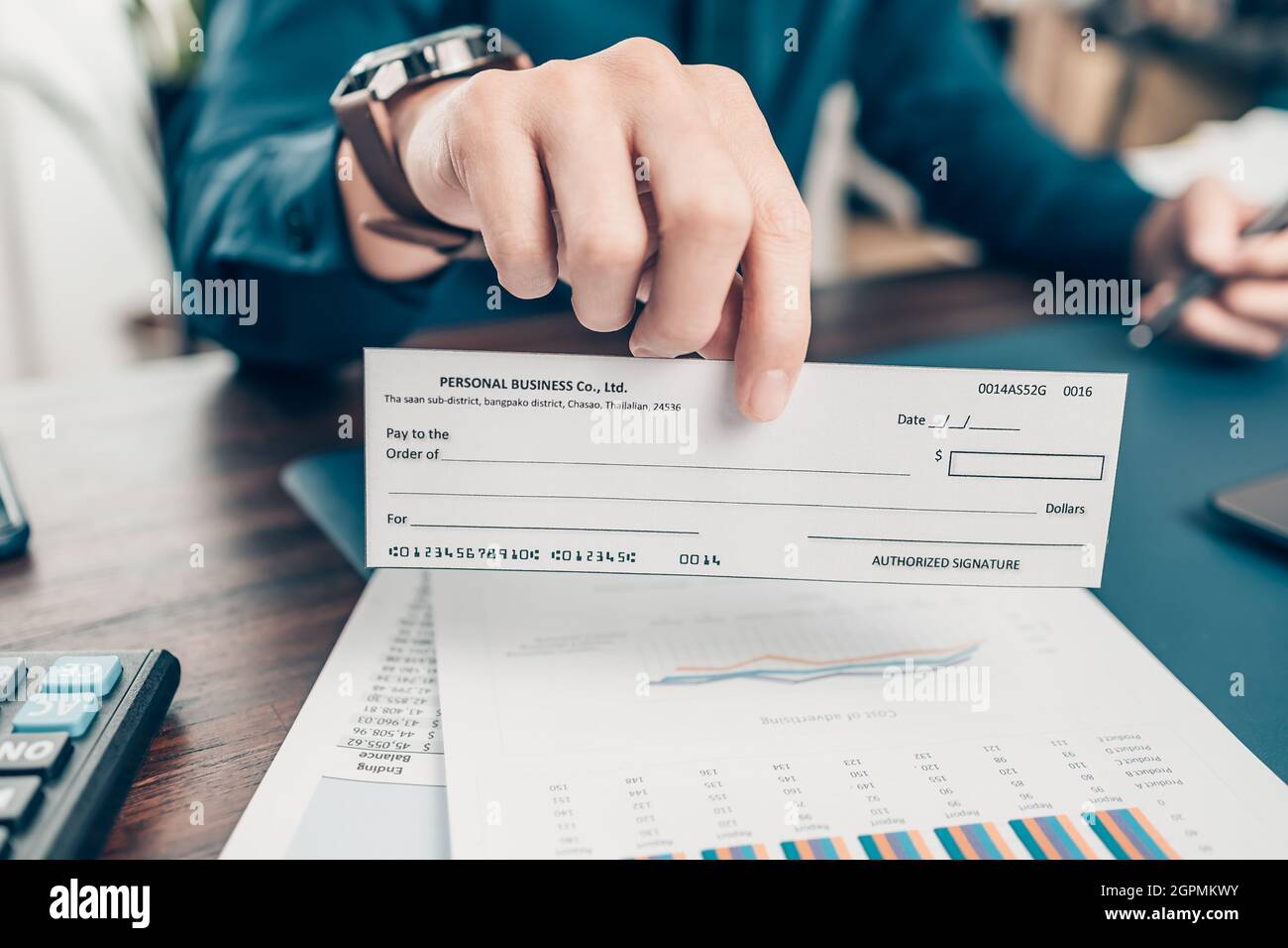A Businessperson's hand giving cheque to customer and dollar bill, coin ...