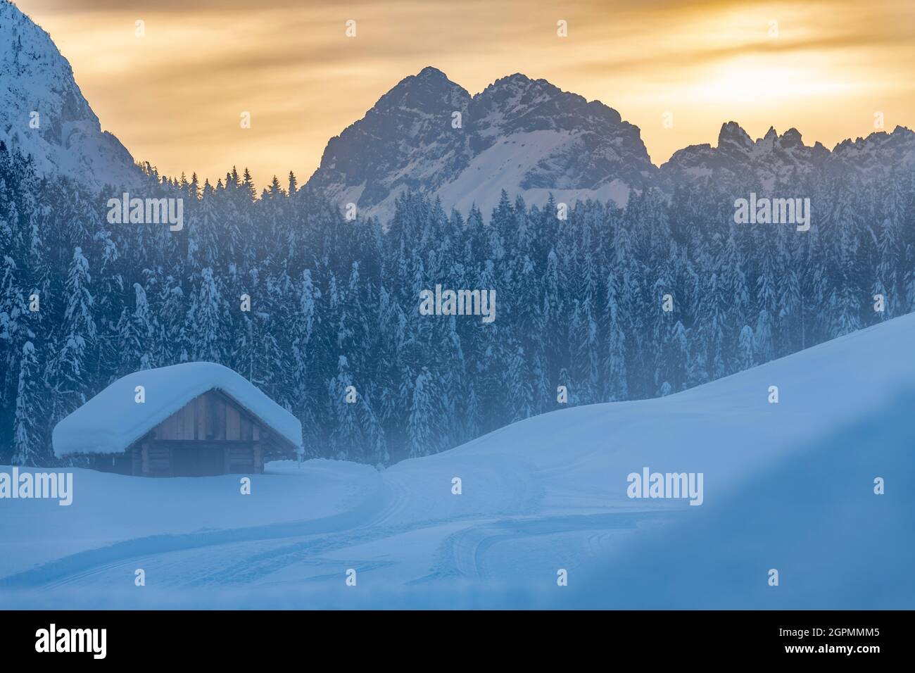 After the snowfall. Dusk on the Sappada plain. Magic of winter Stock Photo - Alamy