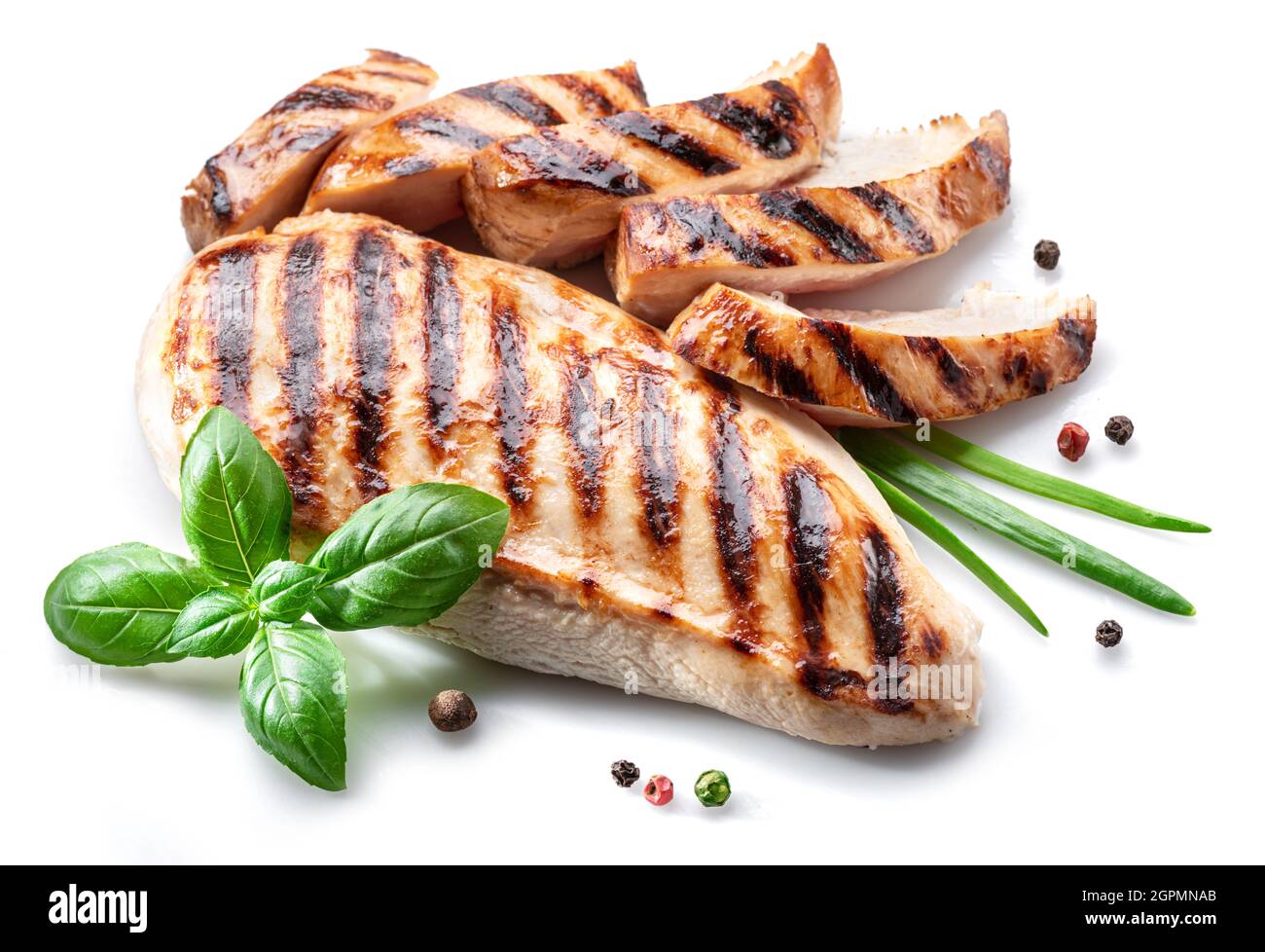 Grilled chicken fillet with herbs isolated on white background Stock ...