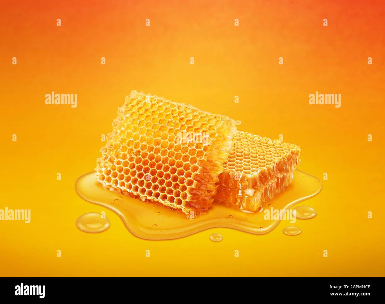 Perfect honey combs lay in puddle of honey isolated on yellow ...