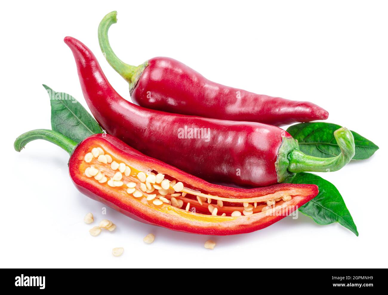 Fresh red chilli pepper and cross sections of chilli pepper with seeds ...