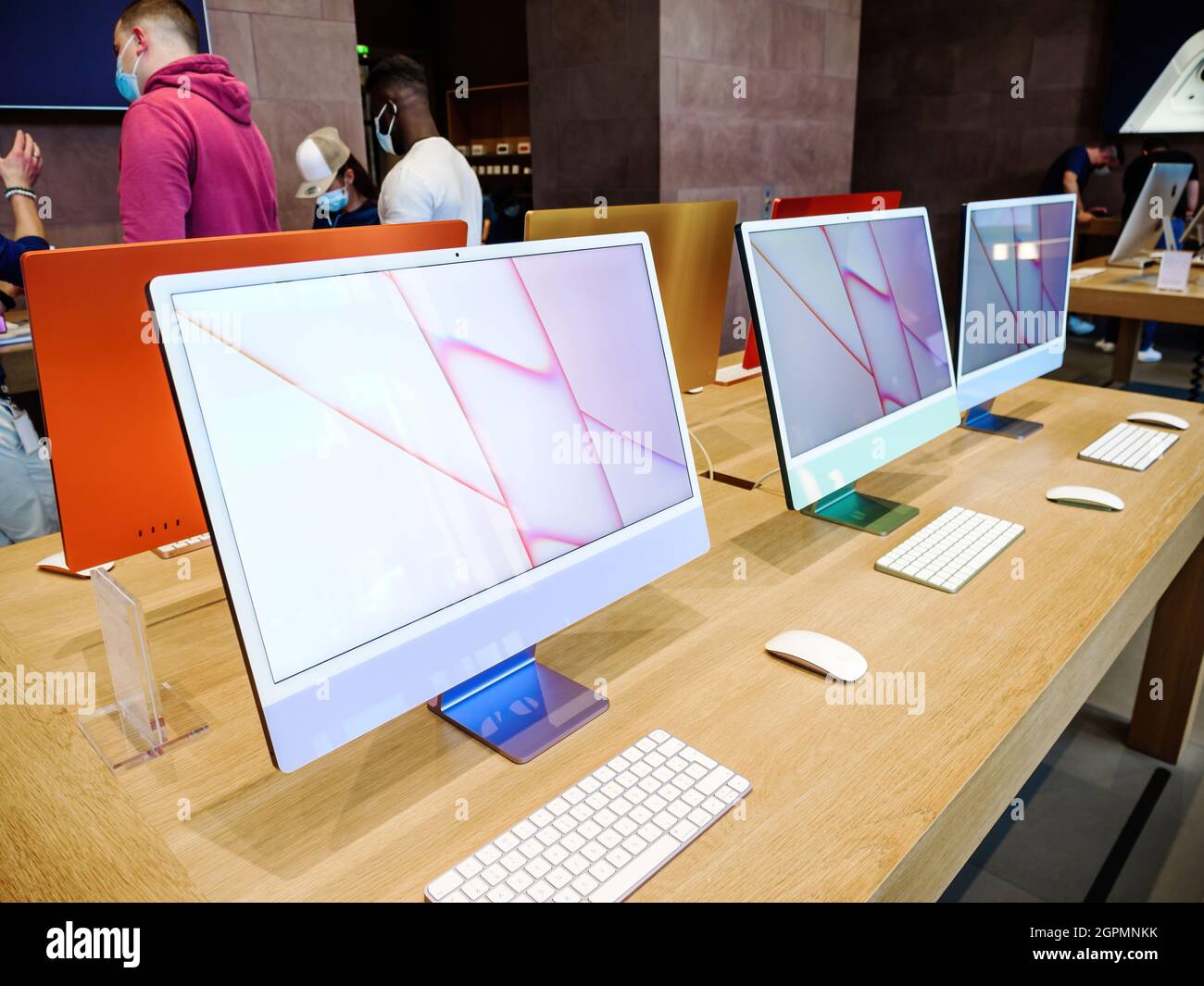 People near colorful iMac colorful 2021 versions the all-in-one ...