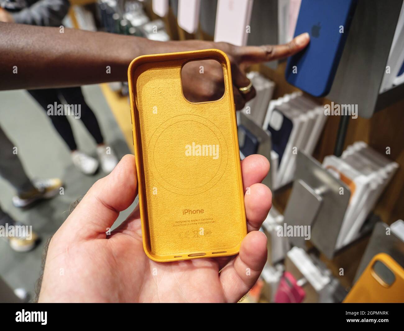 POV male hand holding silicone protection case of iPhone 13 Pro at the ...