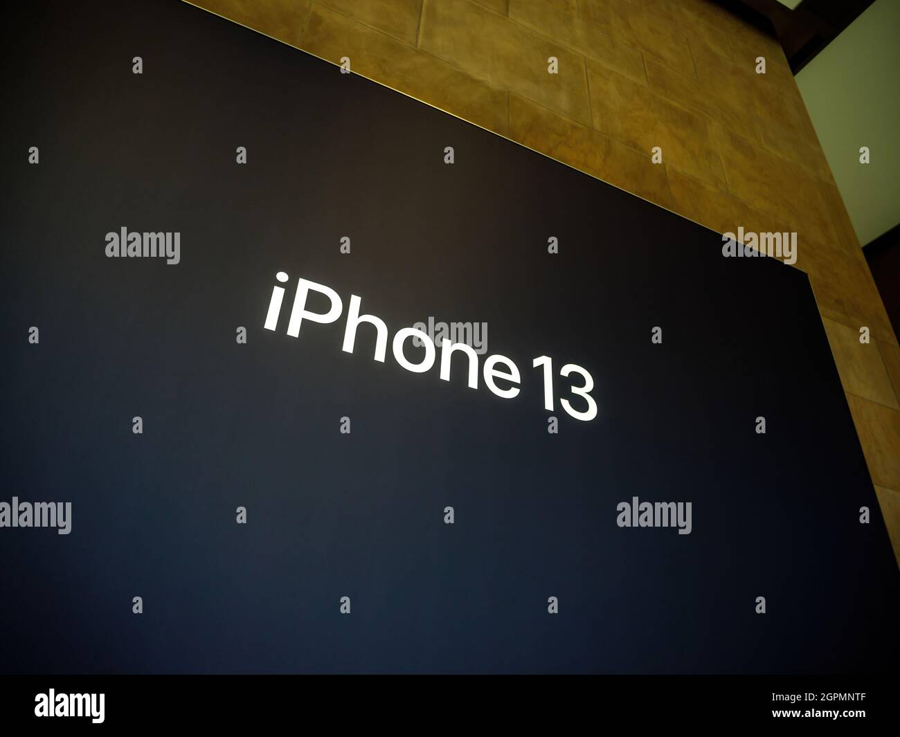 large poster of iPhone 13 at the Apple Store as latest new 5G iPhone 13 ...