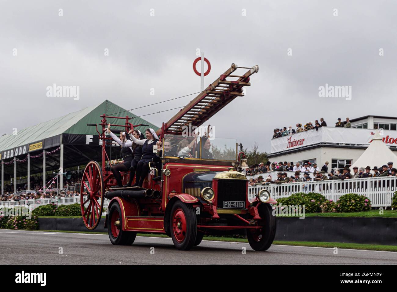 An old fire engine from the London Fire Service parades in front of the ...