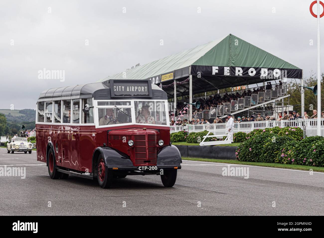 An old single decker bus parades in front of the grandstand at the 2021 ...