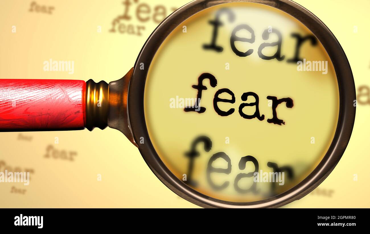 Fear - abstract concept and a magnifying glass enlarging English word ...