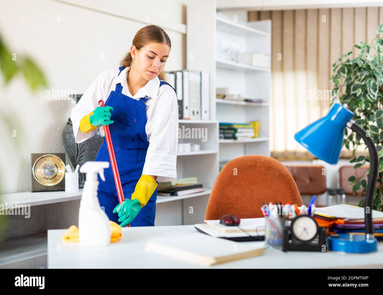 Portrait of professional female worker of office cleaning service ...