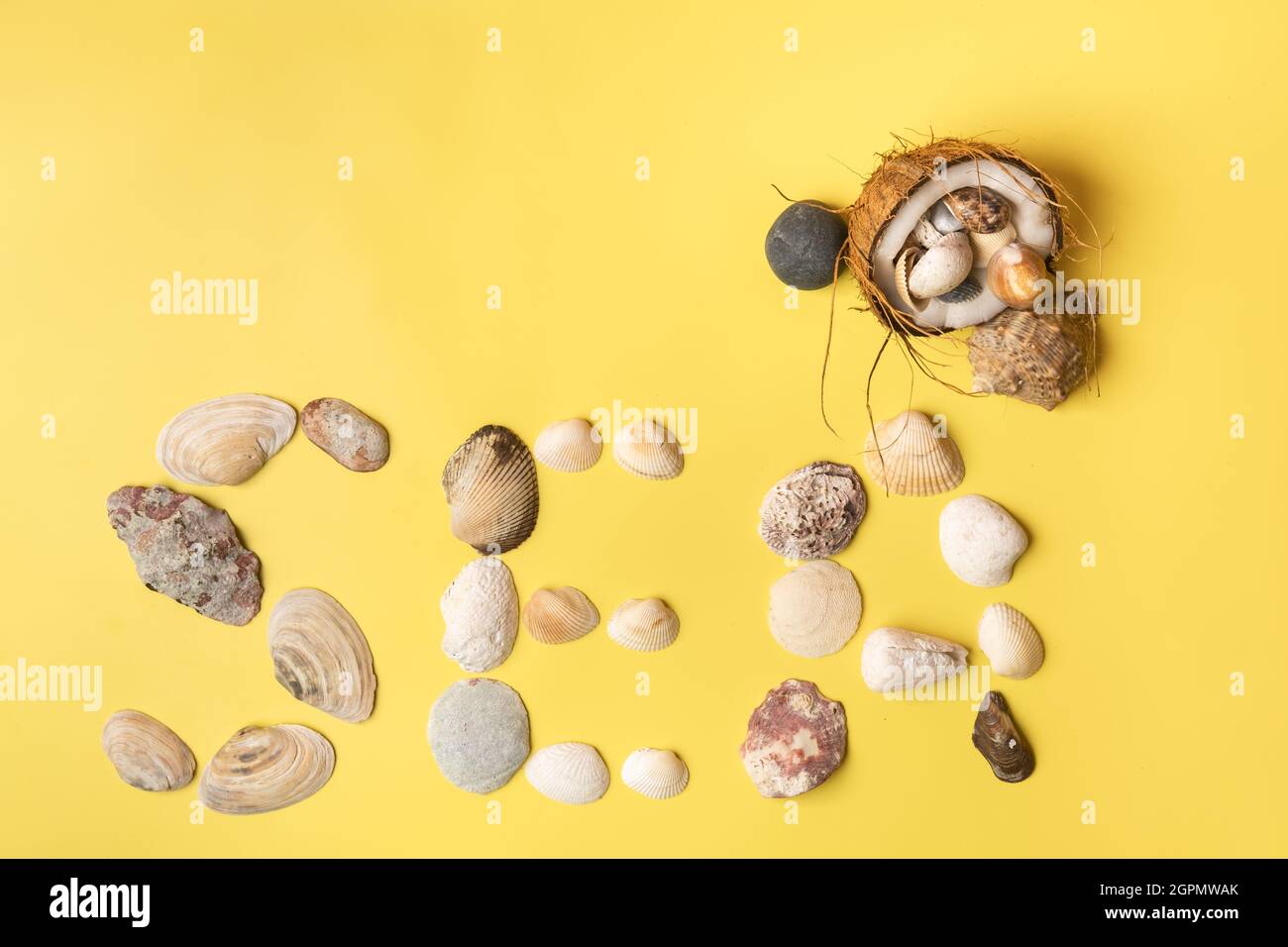 The inscription of the word sea of shells on a yellow background.Travel ...
