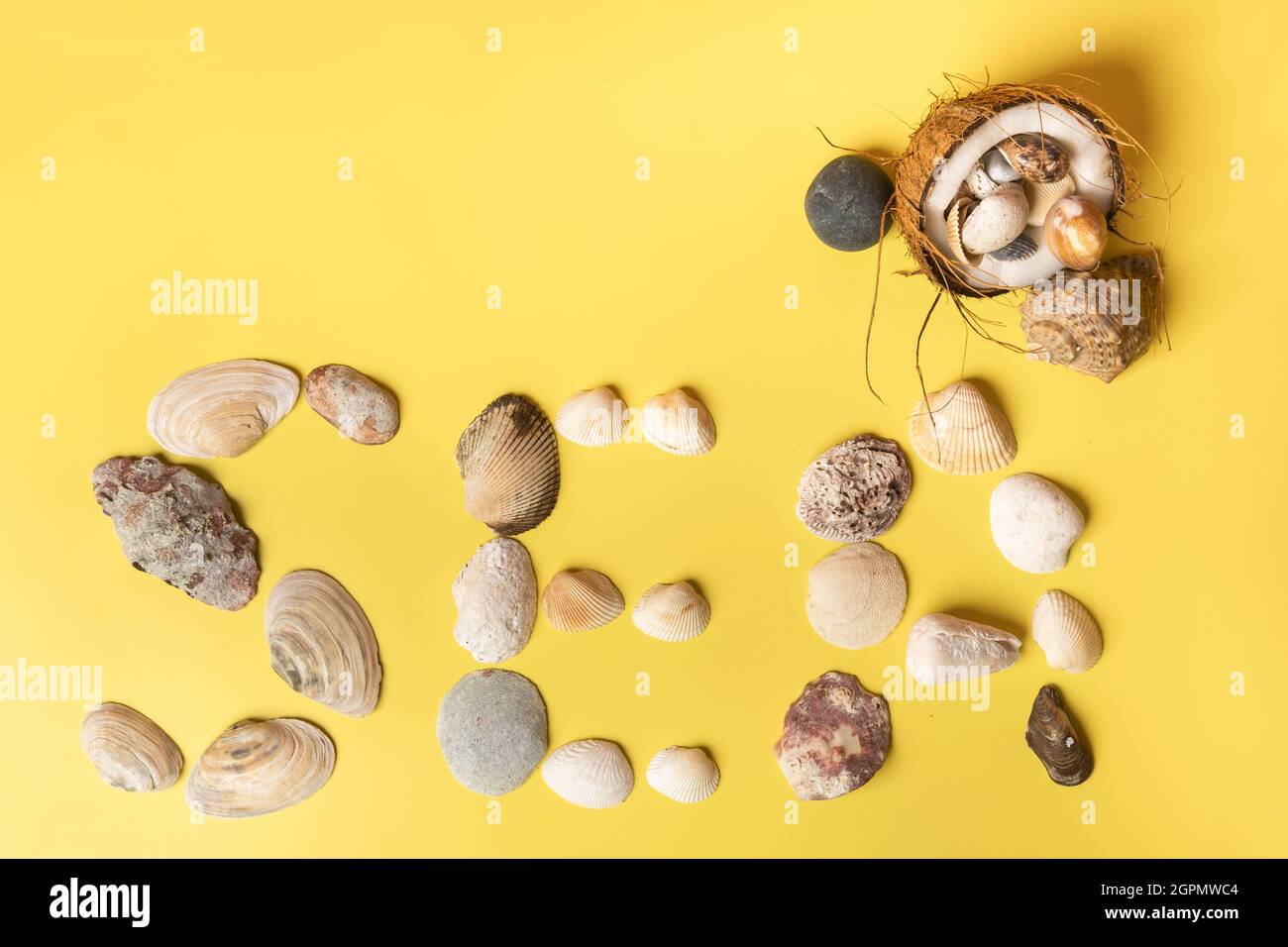 The inscription of the word sea of shells on a yellow background.Travel ...