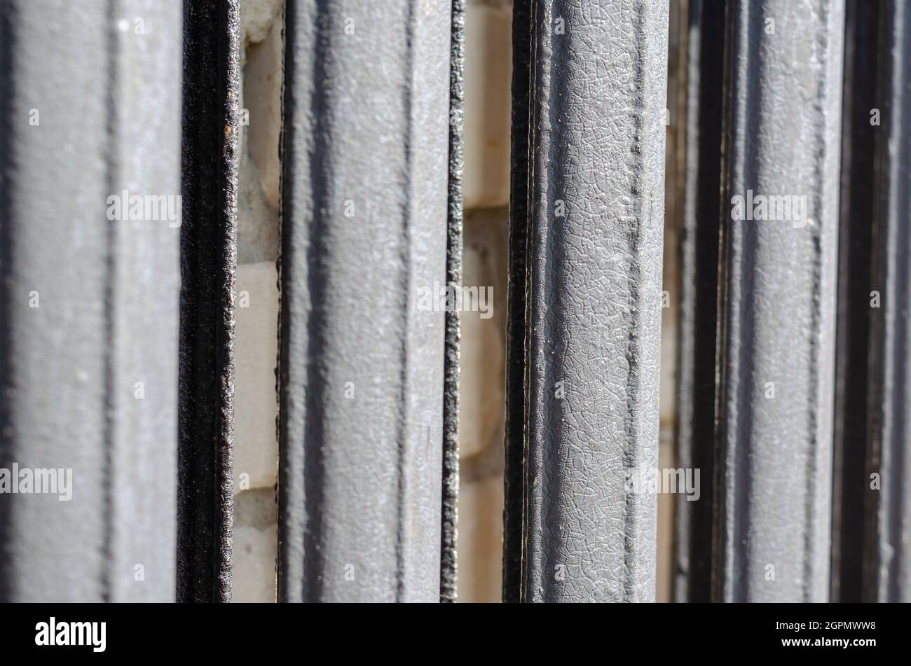 Close-up of a black cast-iron radiator. Cast iron sections of th Stock ...