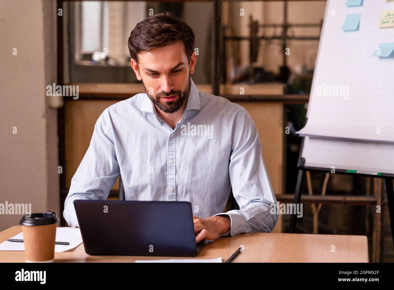 Business man with formal wear working in the office Stock Photo - Alamy