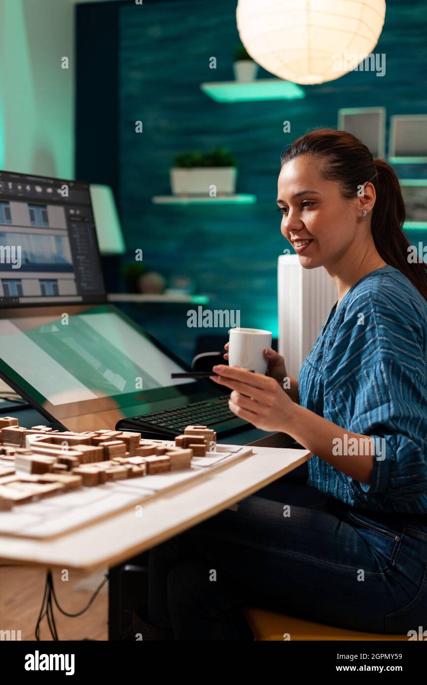 Engineering project designer looking at digital blueprint on computer ...