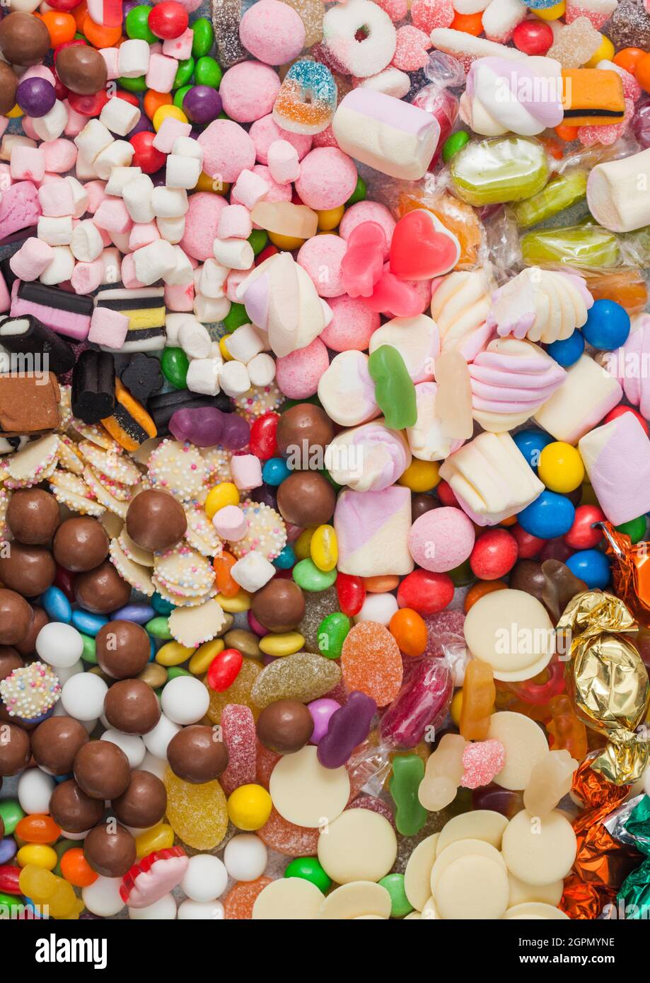 Variety of milk chocolate and jelly sugar gum sweets and candies to use ...