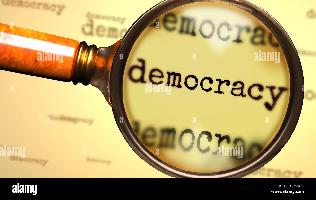 Democracy and a magnifying glass on English word Democracy to symbolize ...