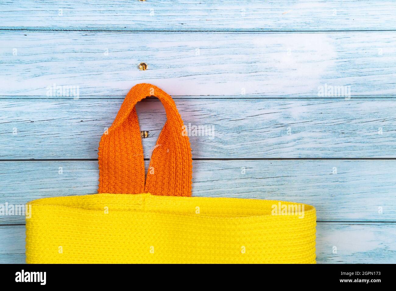 An empty bag with a handle lying on a blue wooden background Stock ...