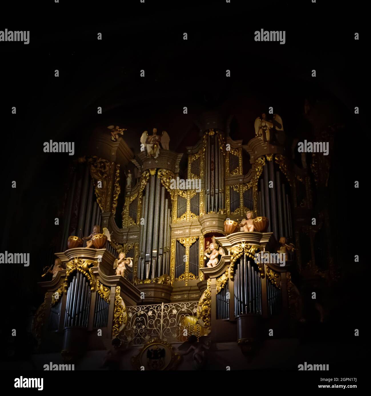 Musical instrument organ with figurines of angels and rays of light as ...