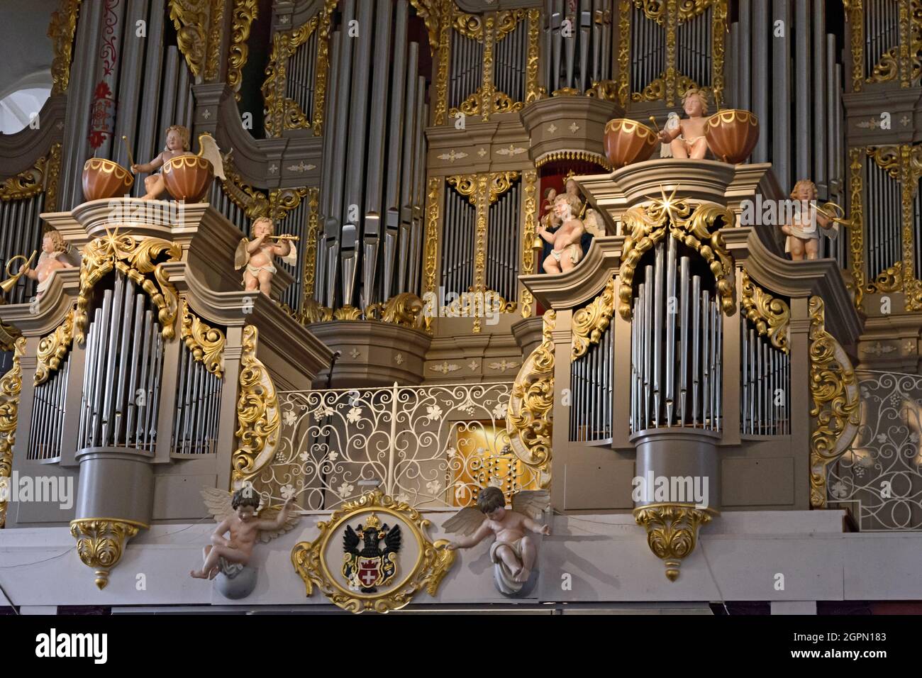 Musical instrument organ with figurines of angels and rays of light as ...