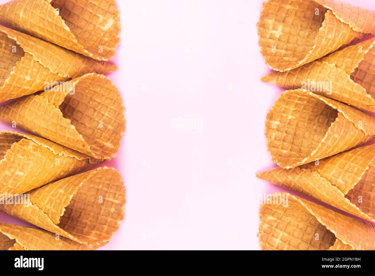 Empty waffle cones for ice cream on a pink background Stock Photo - Alamy