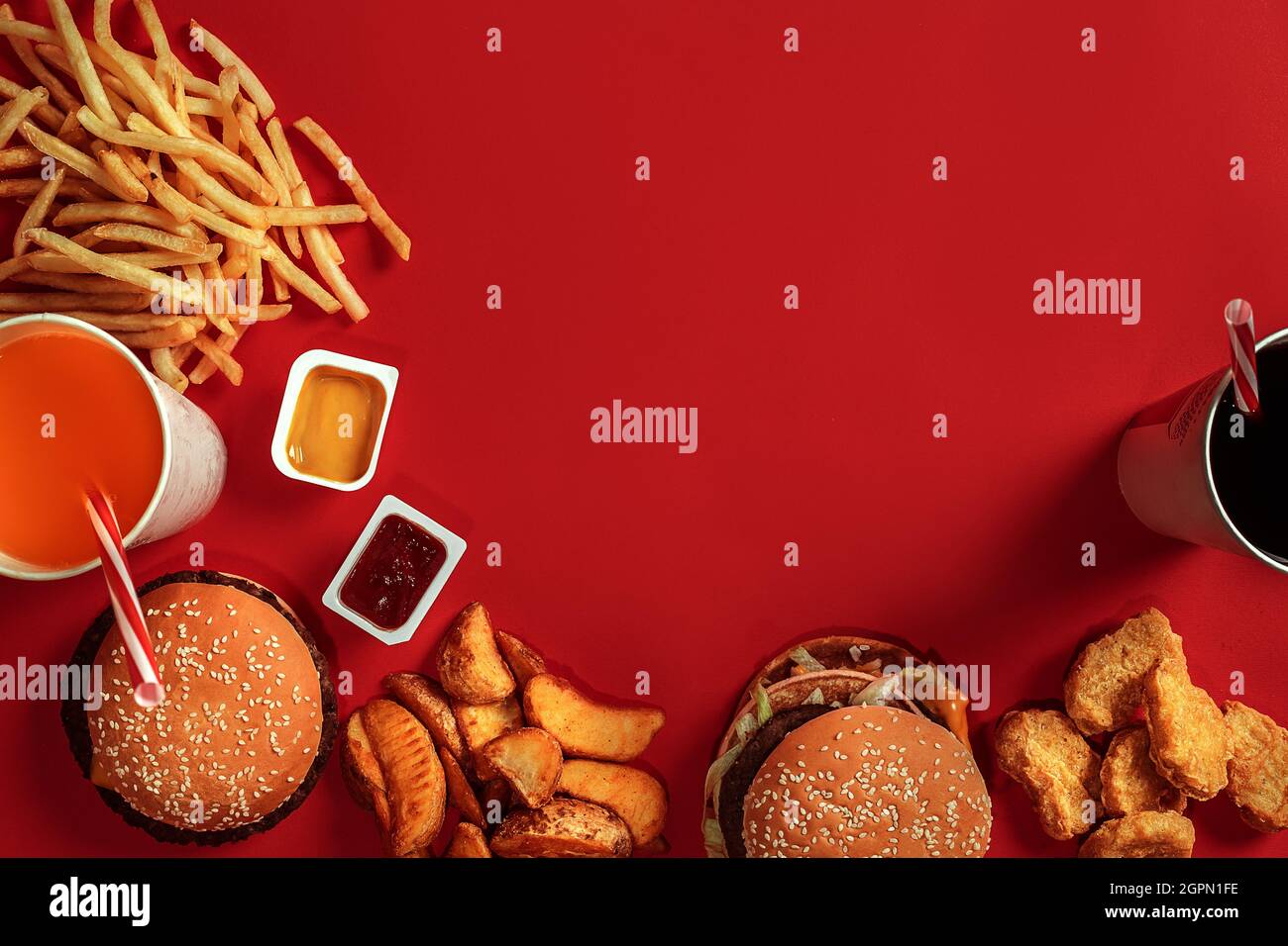 Fast food dish top view. Meat burger, potato chips and glass of drink ...