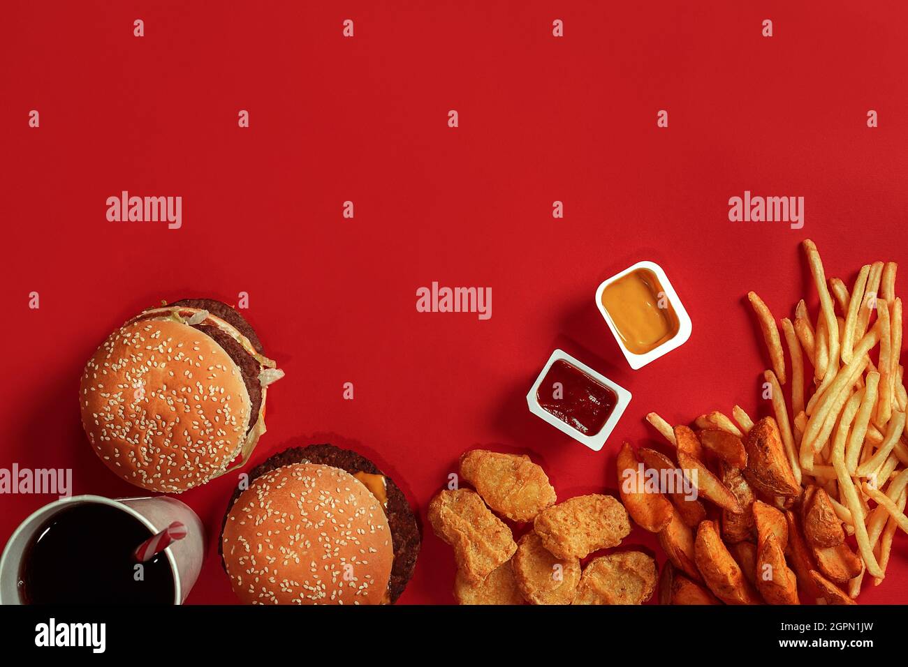 Fast food dish top view. Meat burger, potato chips and glass of drink ...