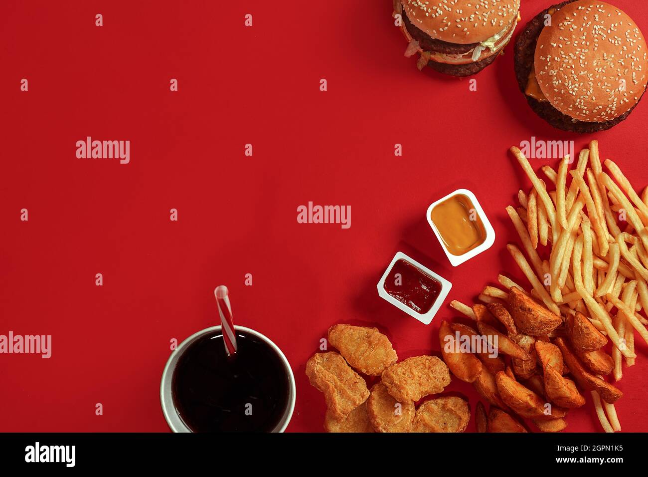 Fast food dish top view. Meat burger, potato chips and glass of drink ...