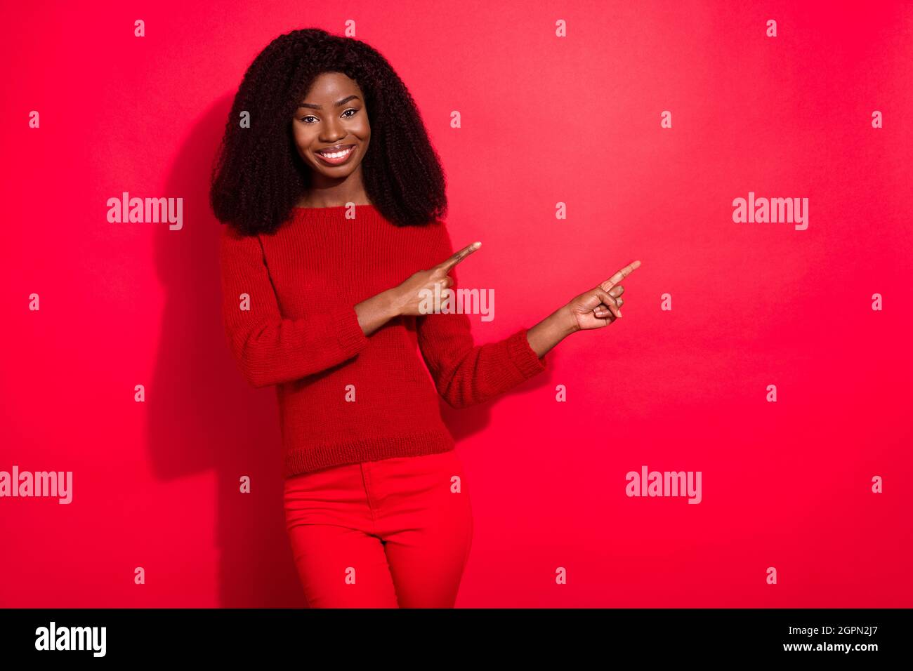Photo of young afro girl happy positive smile point fingers empty space ...