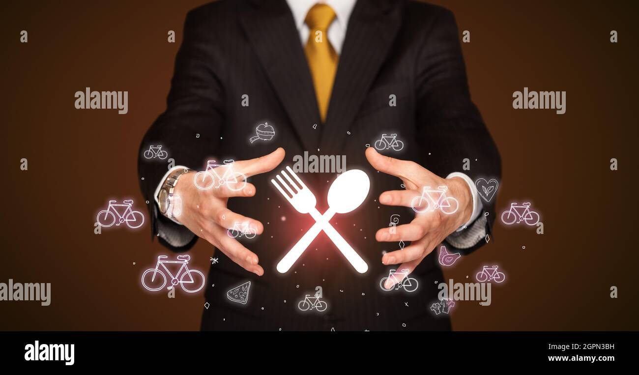 Hand holding food related icons Stock Photo - Alamy
