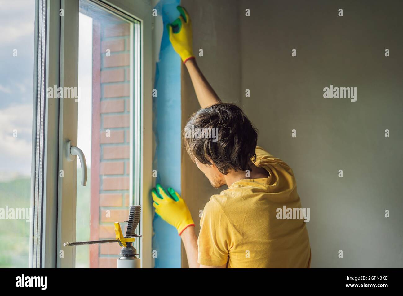 Builder or handyman is engaged in the repair or installation of windows ...
